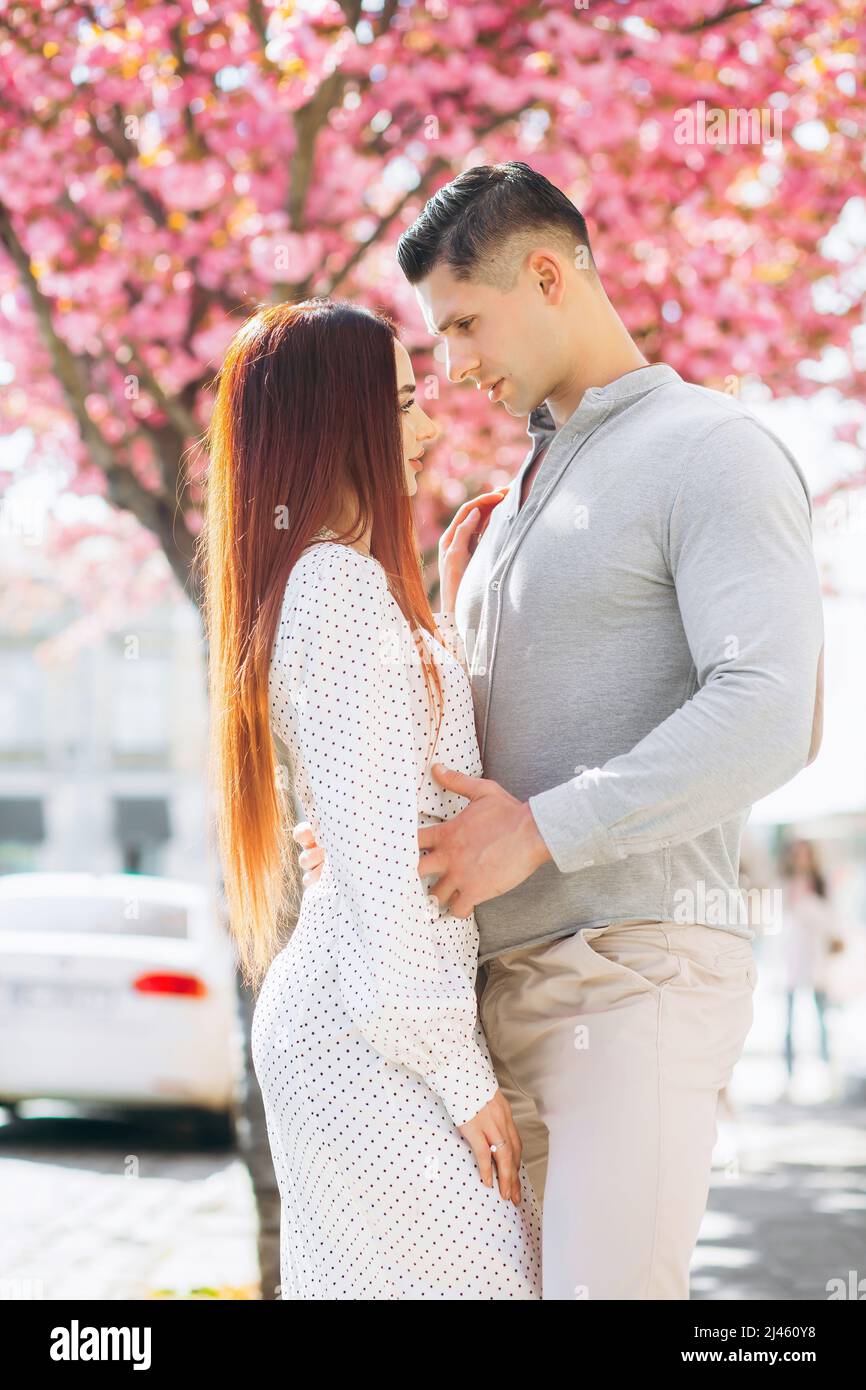 Spring romantic couple in love looking at each other. Sensual couple in ...