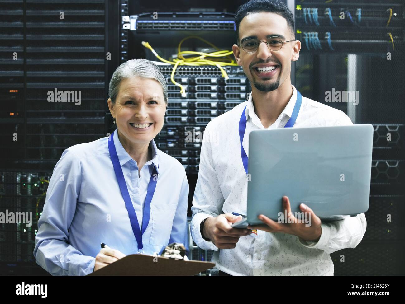 Teamwork makes technology work. Shot of two technicians working ...