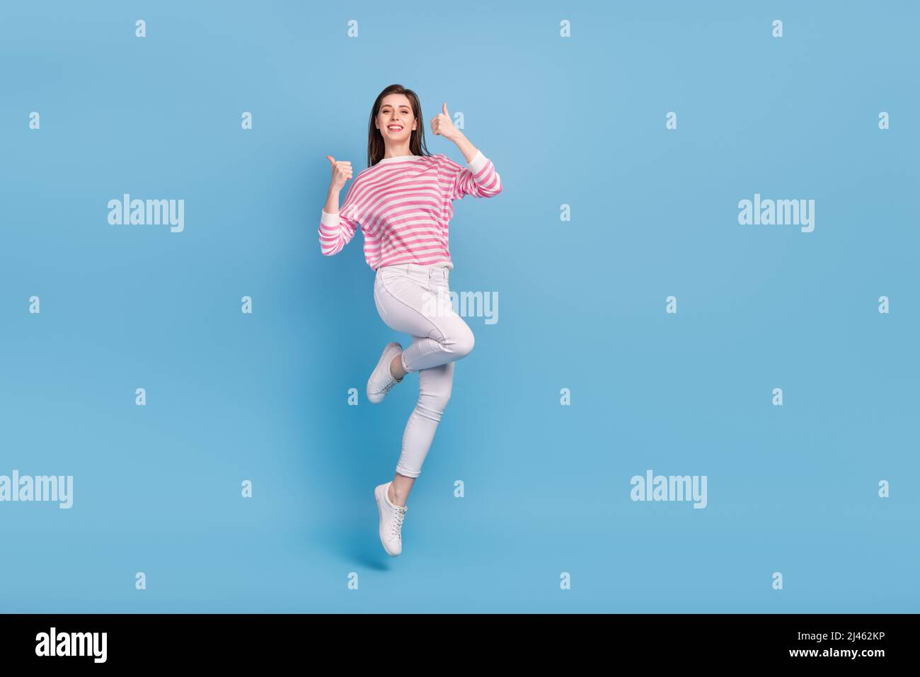 Full body photo of active satisfied person two hands demonstrate thumb ...