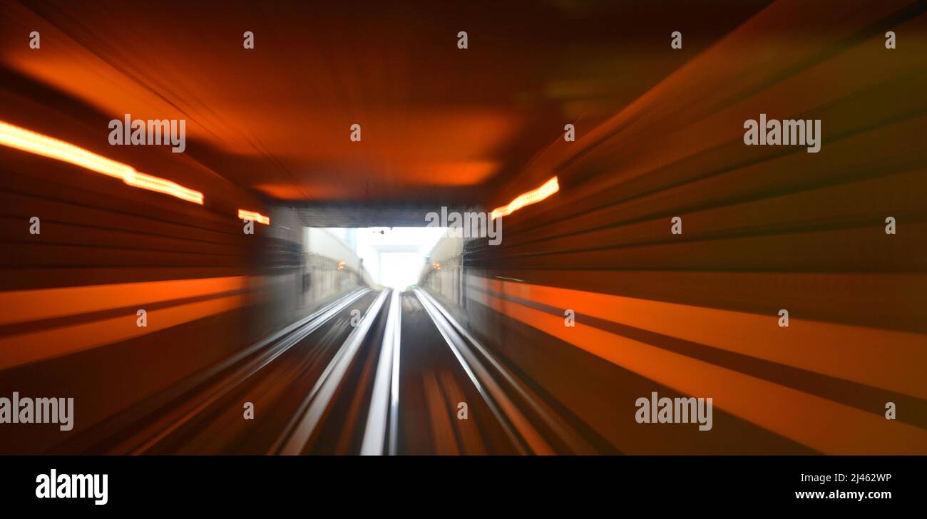 High speed train driving along the rails through a tunnel Stock Photo ...