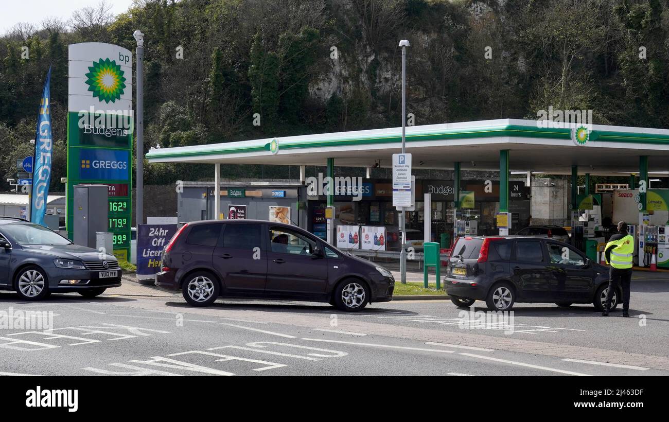Vehicles queue for fuel at a petrol station in Dover, Kent. Picture ...
