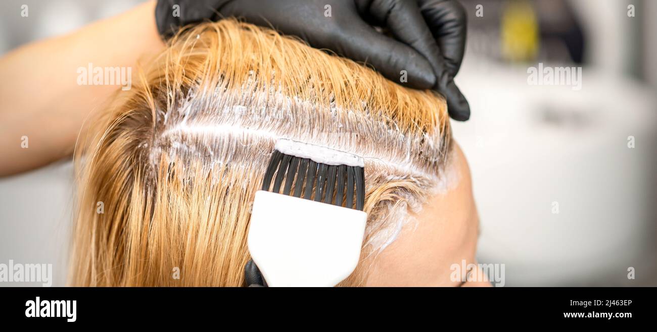 Applying hair dye roots woman hi-res stock photography and images - Alamy