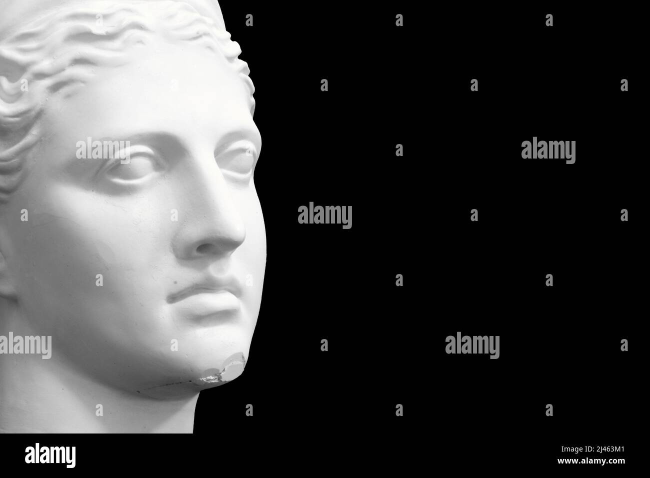 white plaster female statue isolated on black background. High quality ...