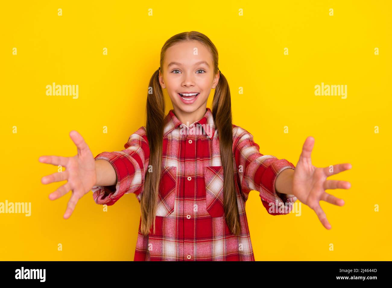 Photo of impressed funky schoolgirl wear checkered shirt open arms ...