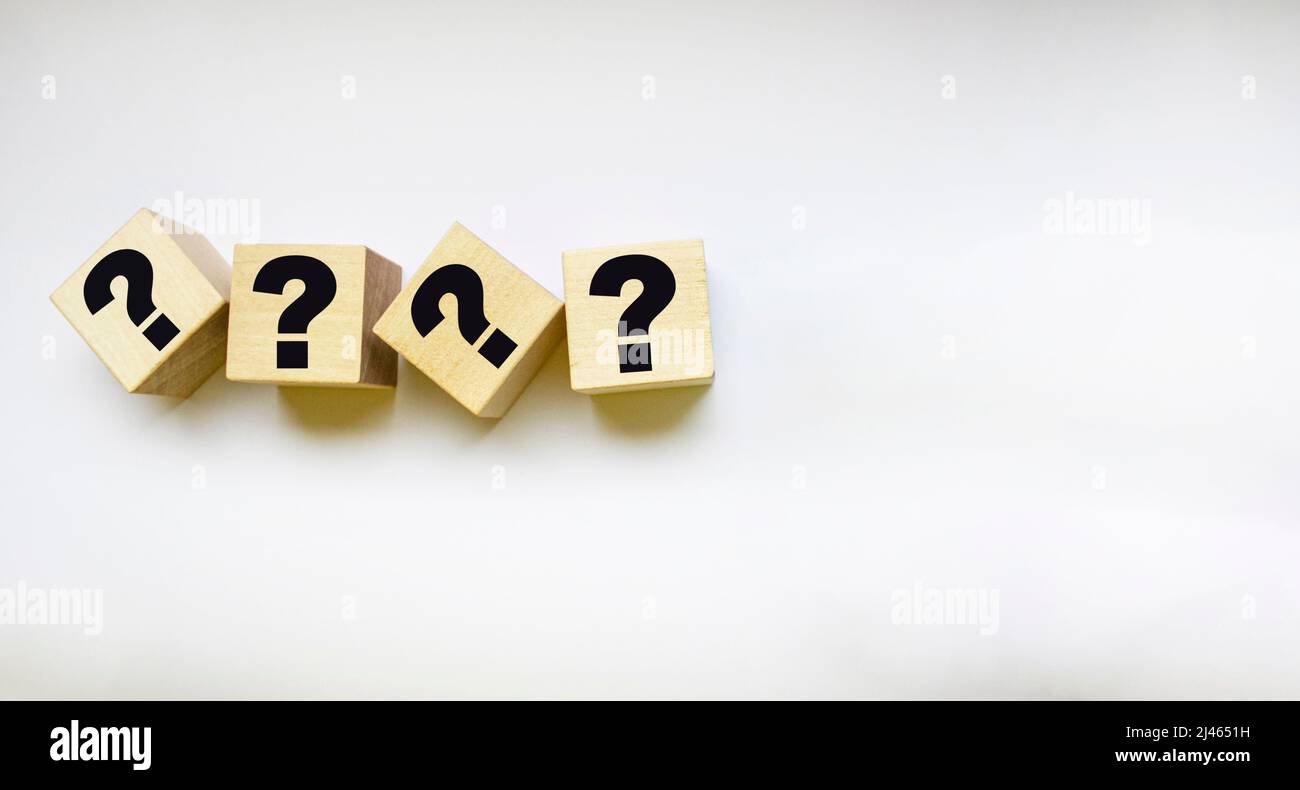 Wooden cube shape with question mark symbol on white background Stock ...