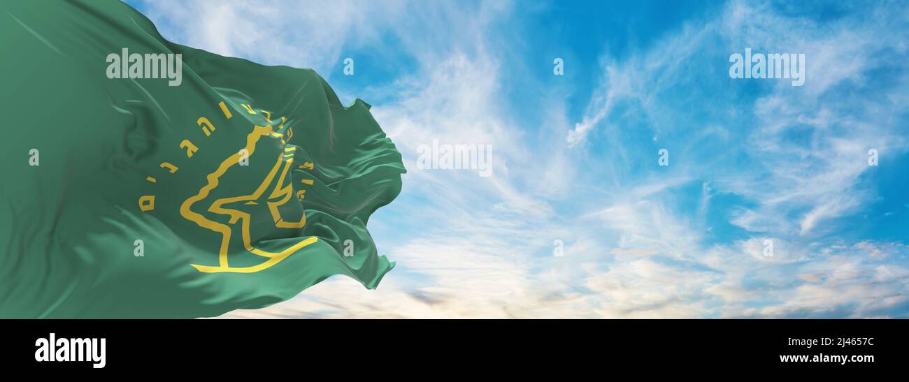 flag of Nature and Parks Authority , Israel at cloudy sky background on ...