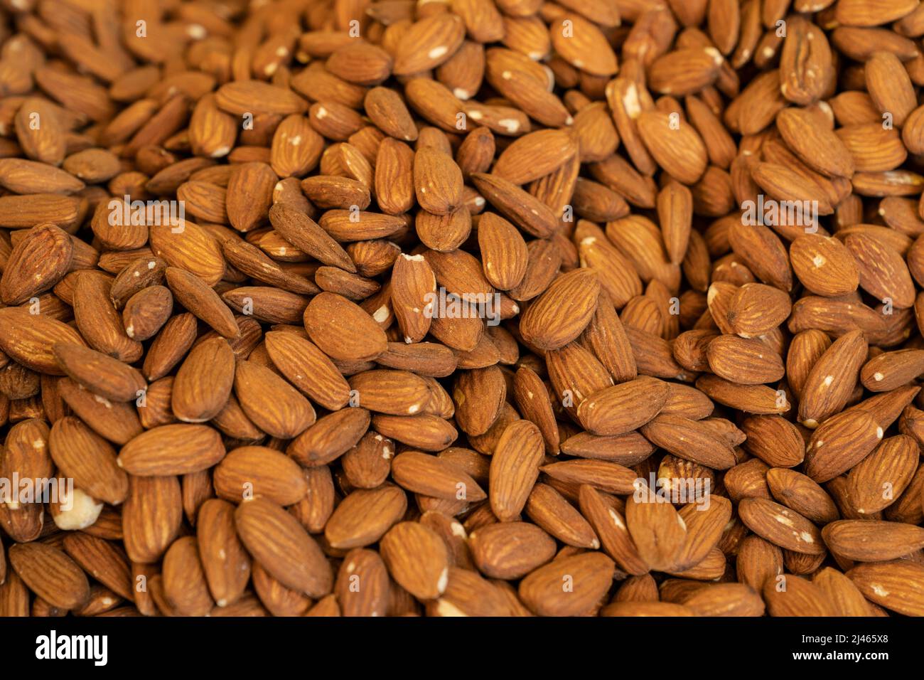 Dried cleaned peeled almond nuts ready to eat as background Stock Photo ...