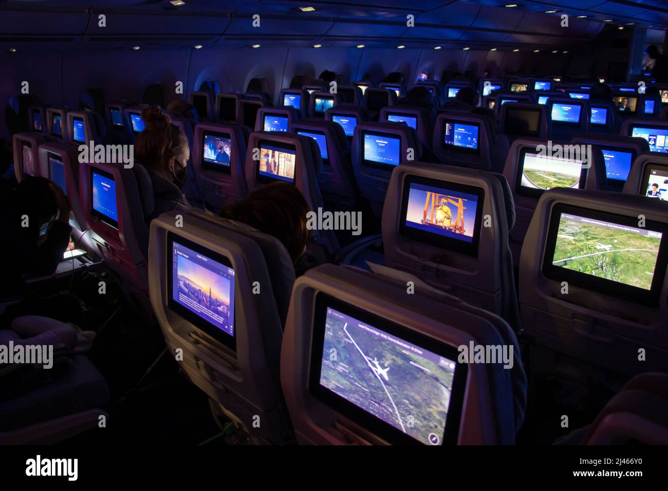 FEB 15 2022, Interior of an flying aircraft with monitors on the seats ...
