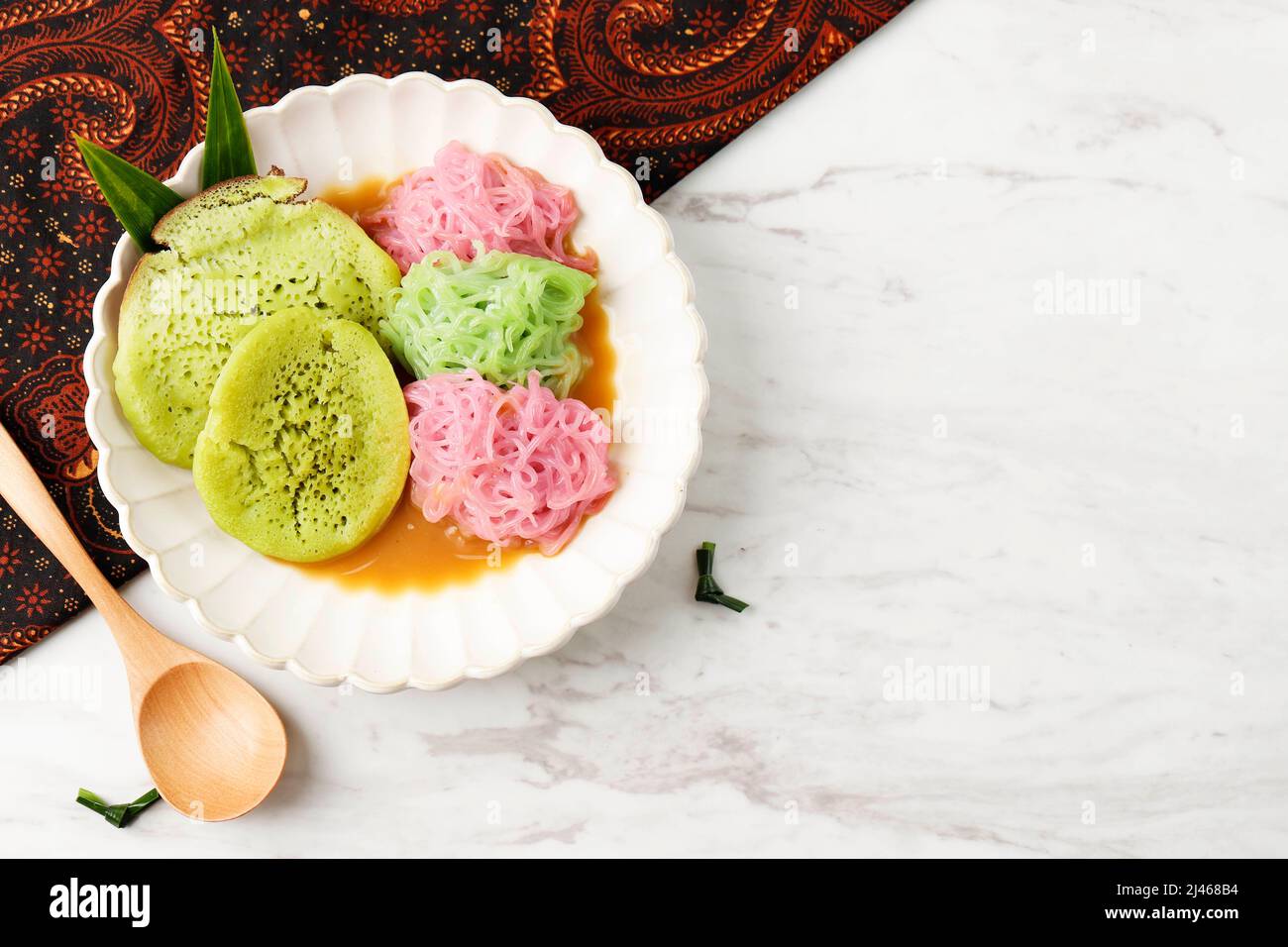 Top View Pethulo, Srabi and Putu Mayang Served with Coconut Milk Palm ...