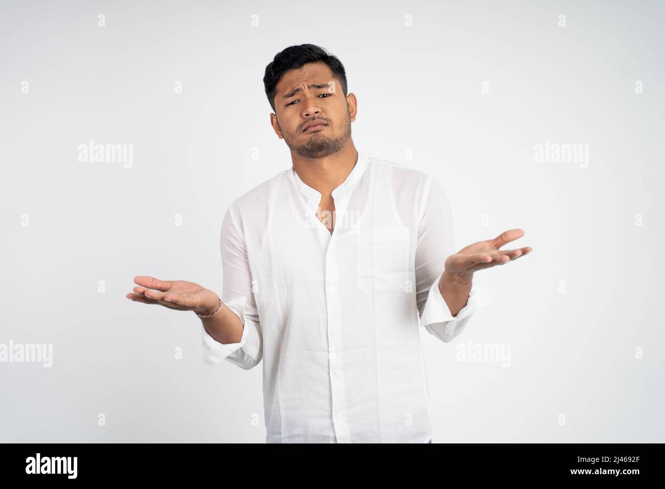man with both hands looking up with a questioning expression Stock ...
