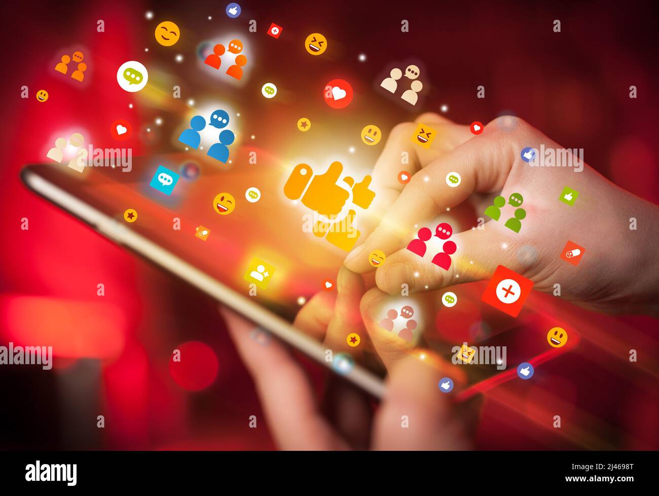Close-up of a hand using tablet with social media icons Stock Photo - Alamy