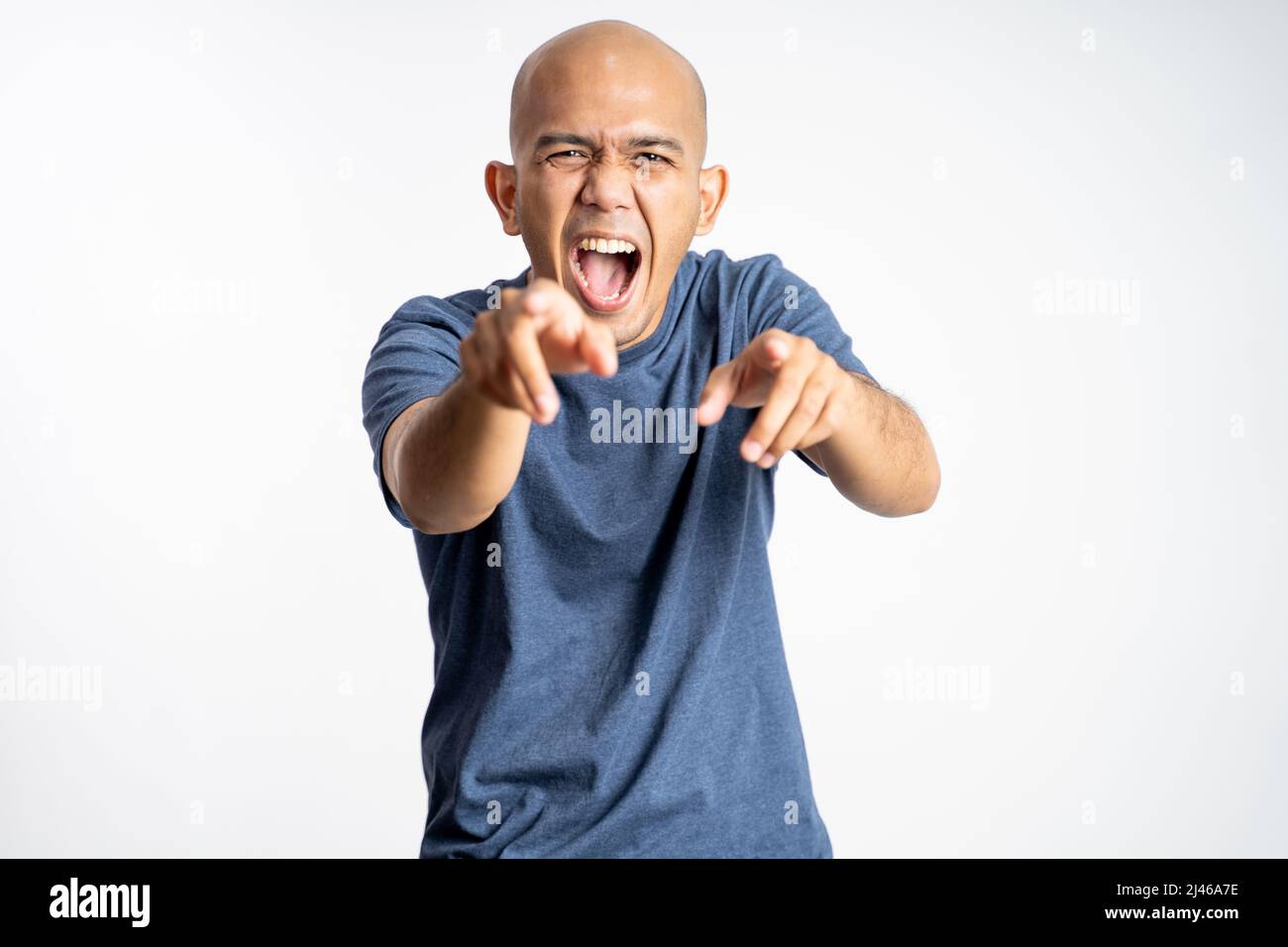 bald man opens mouth wide while laughing with fingers pointing Stock ...