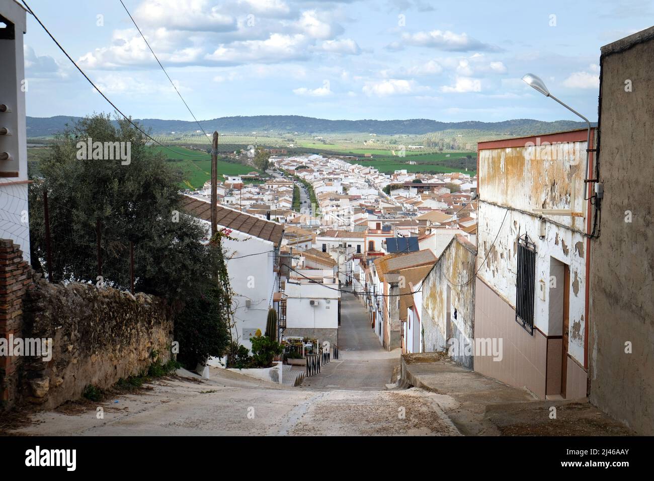 View down one of the steep streets in La Puebla de los Infantes ...