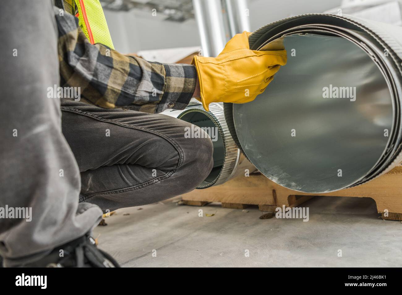 Commercial HVAC Construction Worker Preparing Metal Air Duct For an ...