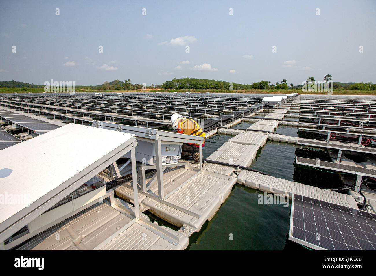 Rayong, Thailand. 11th Apr, 2022. A staff member checks the inverter of ...