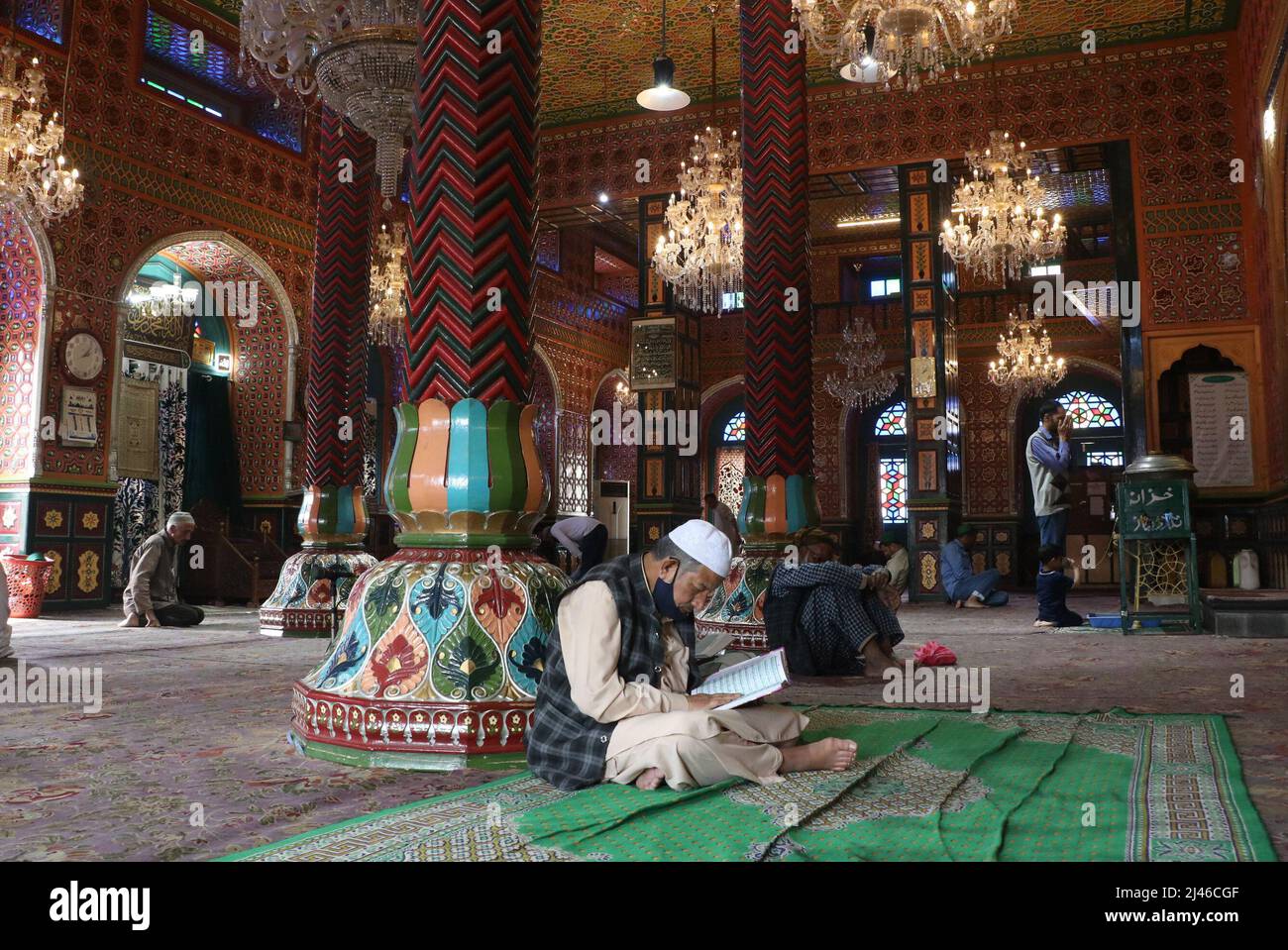 Srinagar, India. 12th Apr, 2022. A Muslim read Quran during holy month ...
