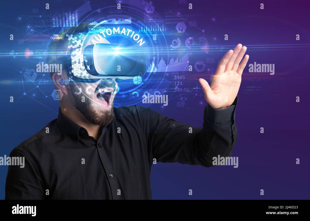Businessman looking through VR glasses Stock Photo - Alamy