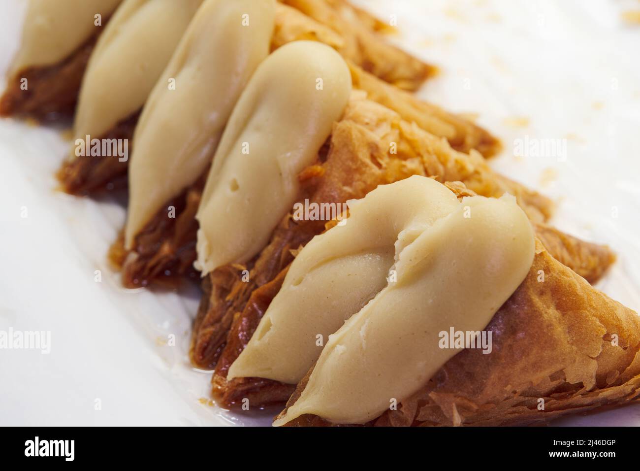 Trigona Panoramatos - crispy phyllo triangle pastries with custard ...