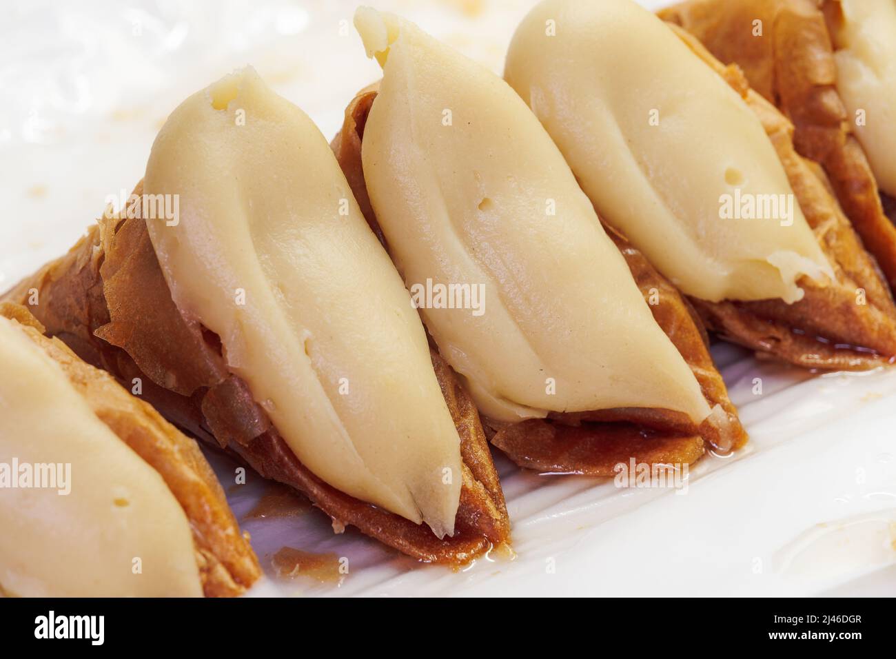Trigona Panoramatos - crispy phyllo triangle pastries with custard ...