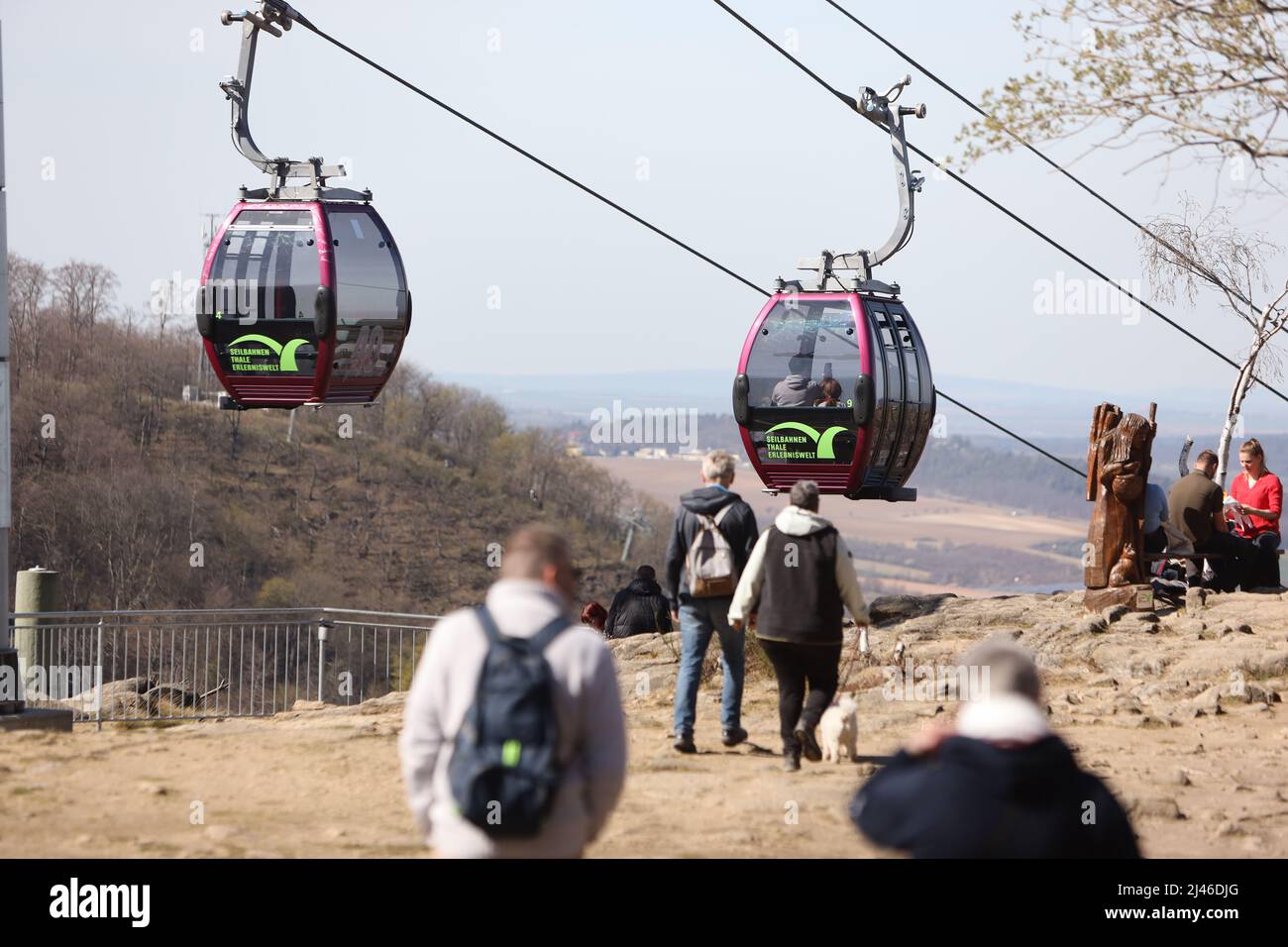 Thale, Germany. 12th Apr, 2022. Visitors stand at the top station of ...