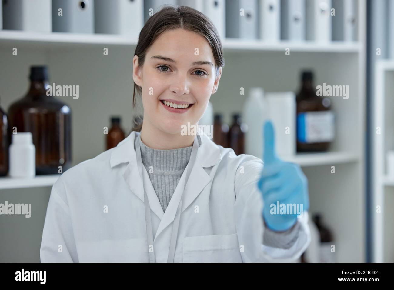 Proving all her theories correct. Portrait of a young scientist showing ...