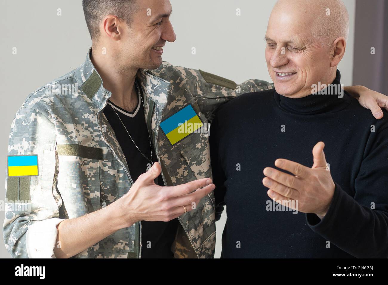 Elderly dad hugs a Ukrainian soldier. Militarization. Ukrainian ...