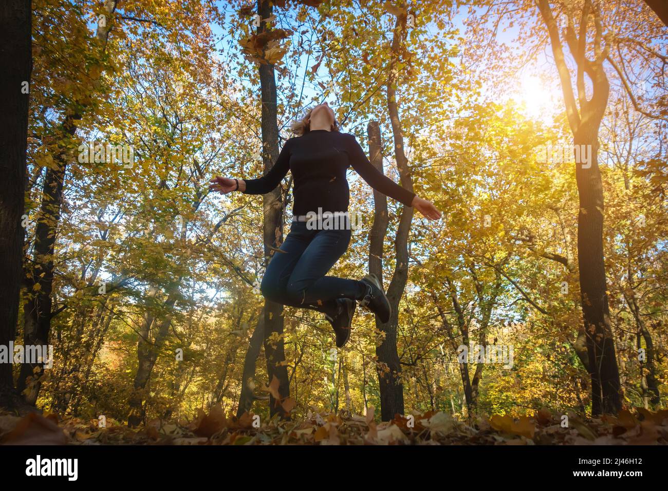 Girl throws up autumn hi-res stock photography and images - Alamy