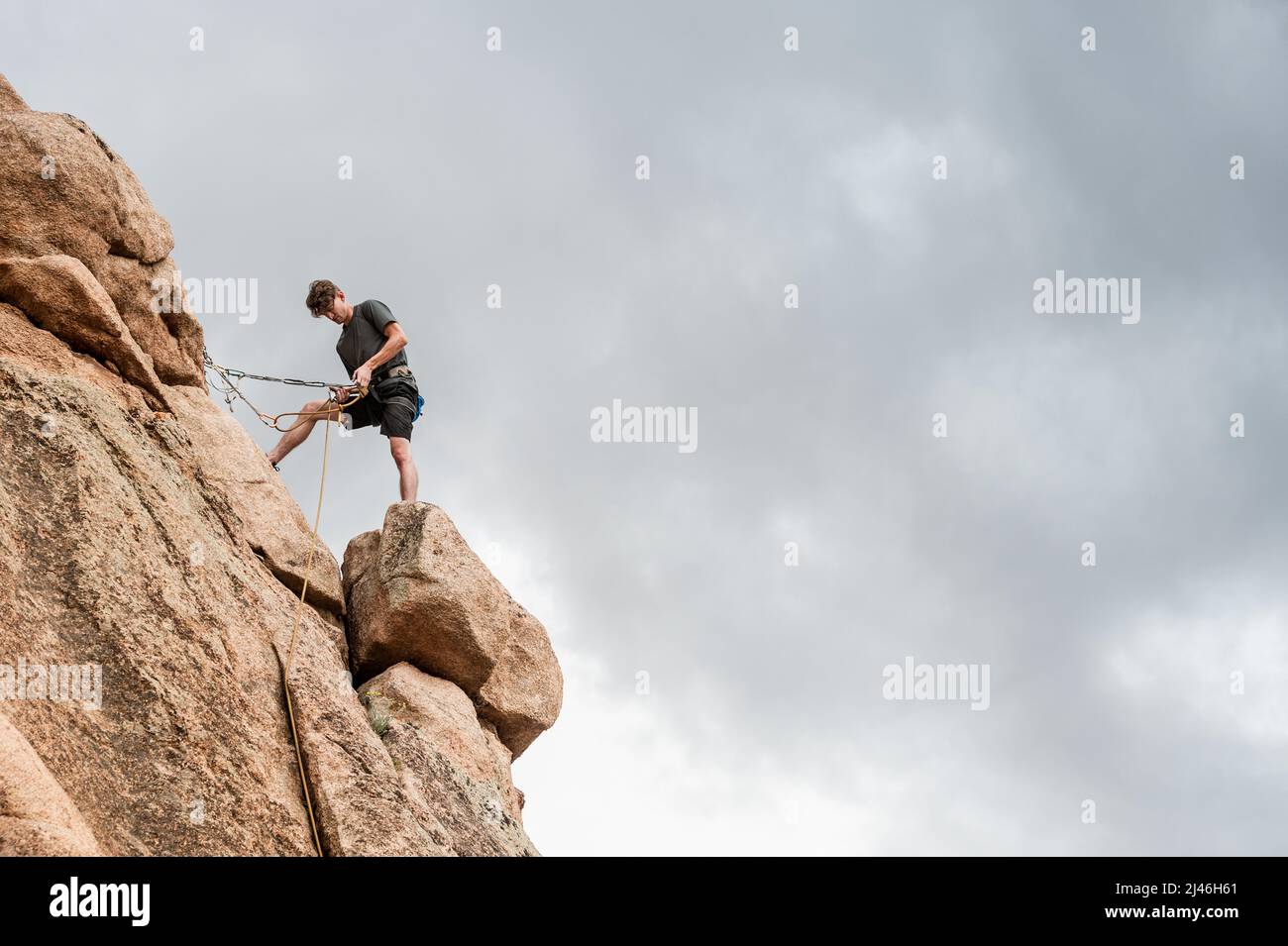 A groupd of friends rock climbing and camping in the summer Stock Photo ...