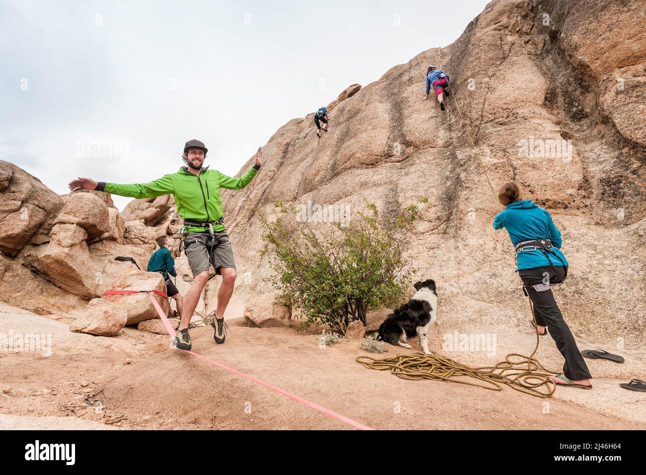 A groupd of friends rock climbing and camping in the summer Stock Photo ...