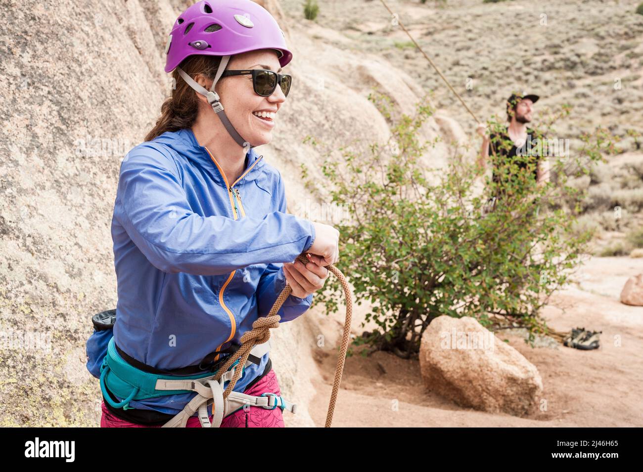 A groupd of friends rock climbing and camping in the summer Stock Photo ...