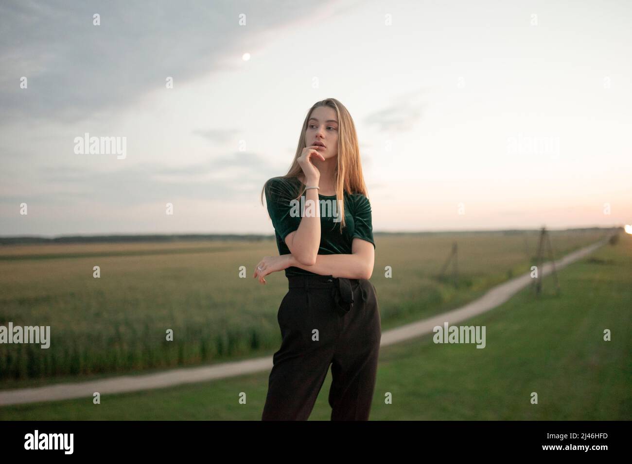 Woman thinking on a country road Stock Photo - Alamy