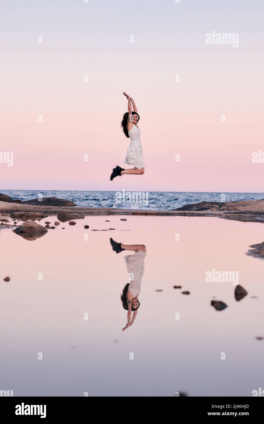 Woman jump in water hi-res stock photography and images - Alamy