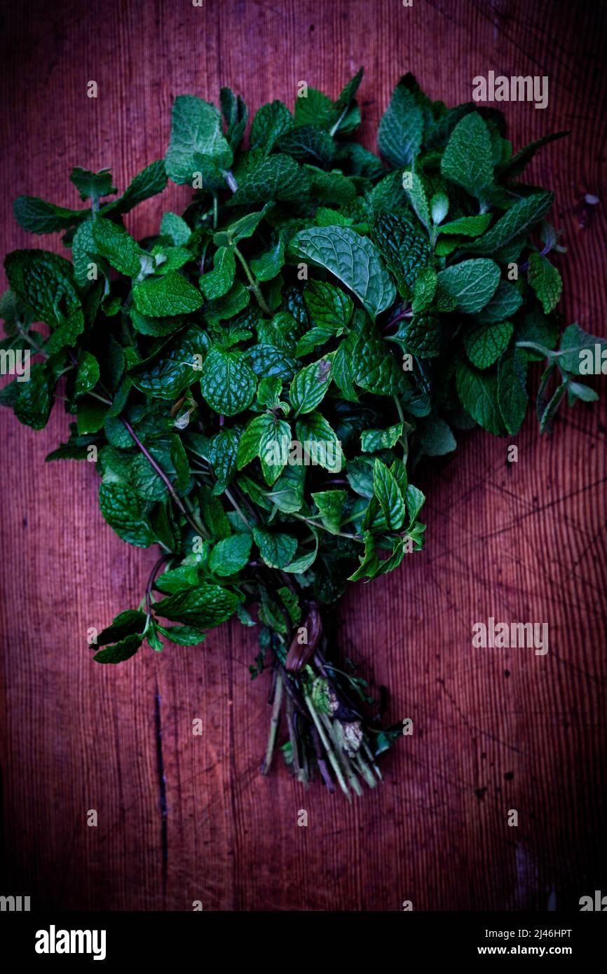 Fresh mint and muña on a table background Stock Photo - Alamy