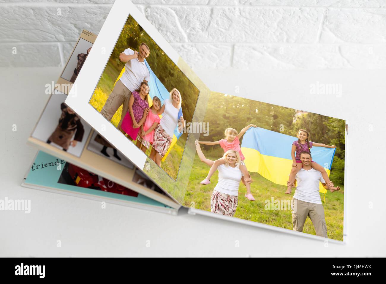 Family photos archive saved in brightly designed photo book; bright ...