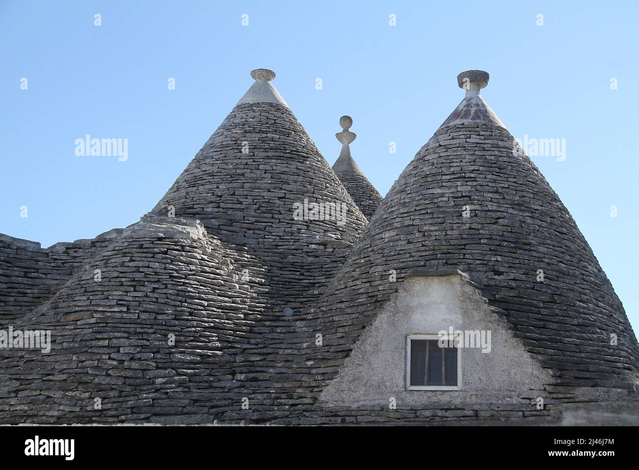 The conic roofs, with pinnacle, of 500-year-old traditional trulli rock ...