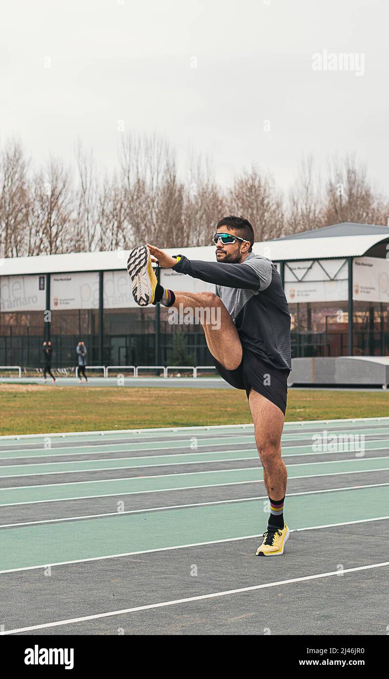 man running on a running track Stock Photo - Alamy