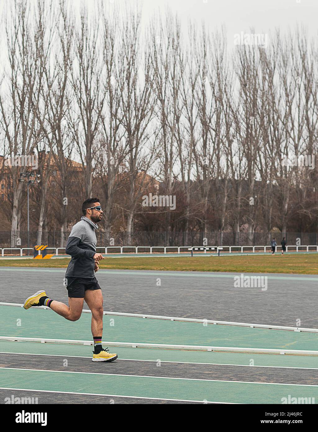 man running on a running track Stock Photo - Alamy