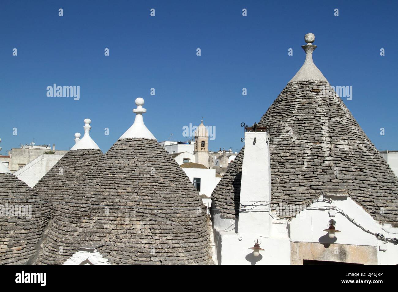 The conic roofs, with pinnacle, of 500-year-old traditional trulli rock ...