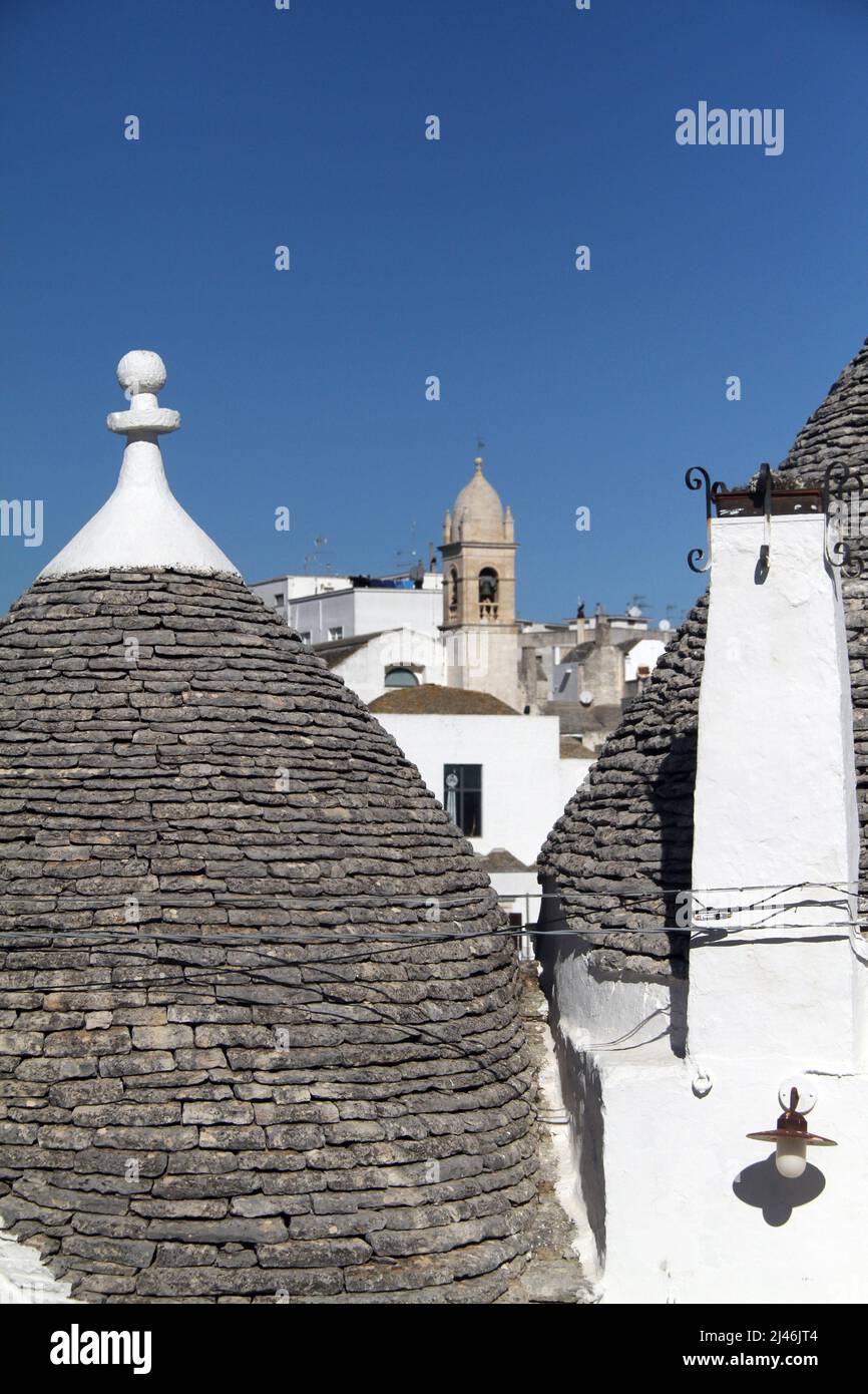 The conic roofs, with pinnacle, of 500-year-old traditional trulli rock ...