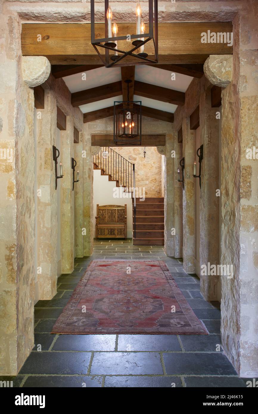 Hallway with beautiful stone work looking towards stairway Stock Photo ...