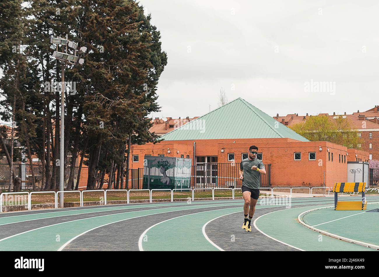 man running on a running track Stock Photo - Alamy