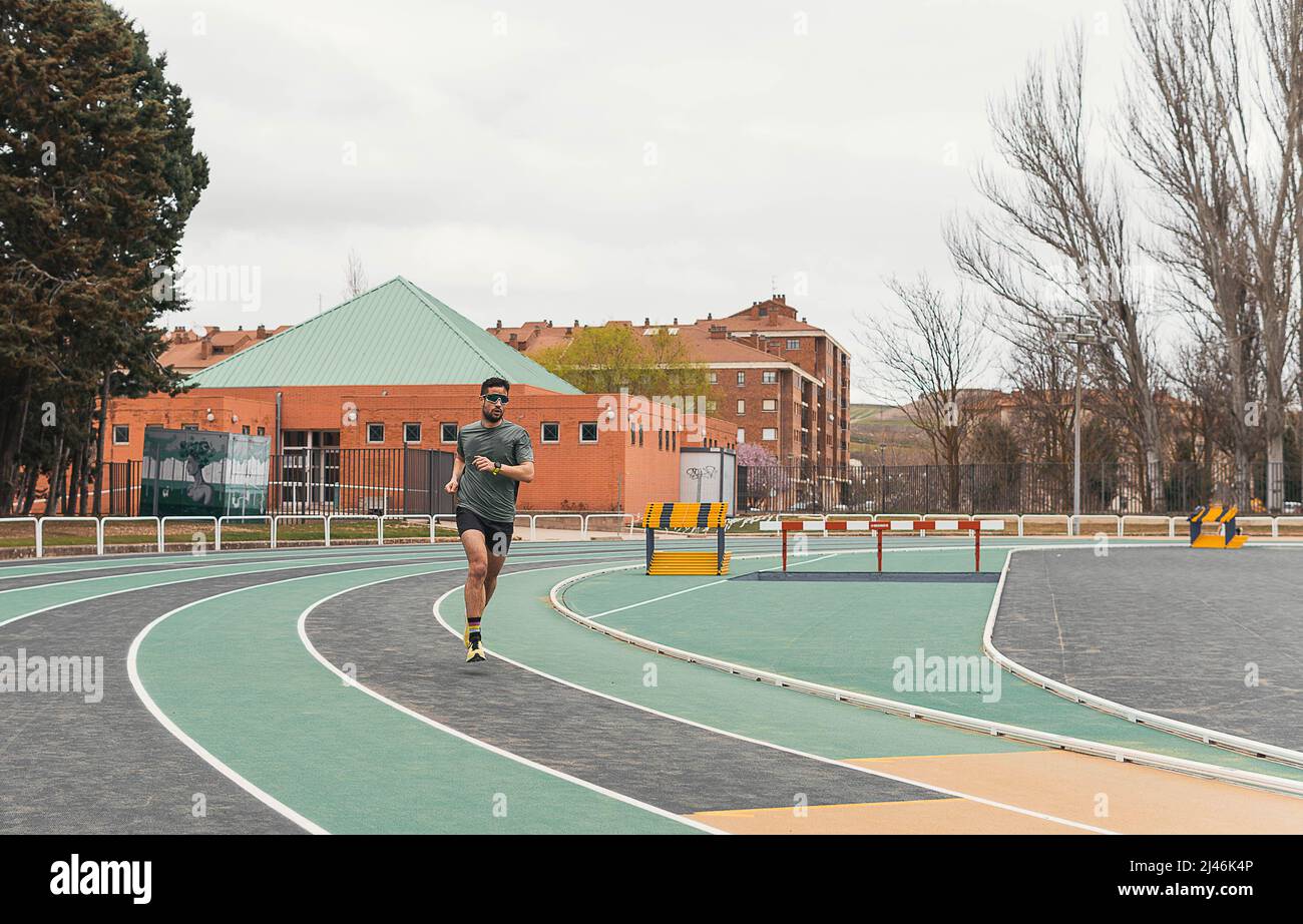 man running on a running track Stock Photo - Alamy