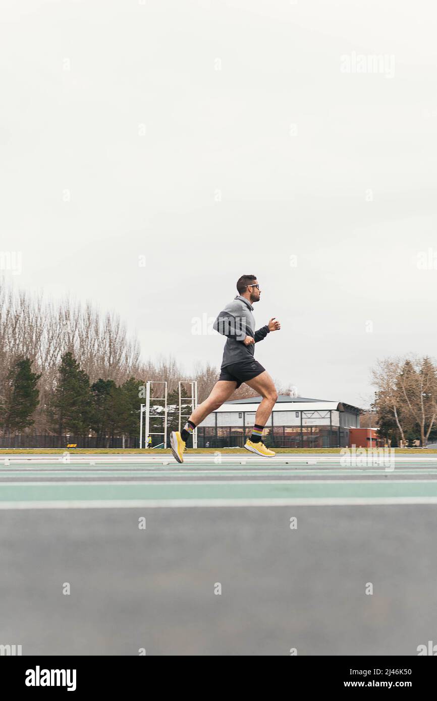 man running on a running track Stock Photo - Alamy