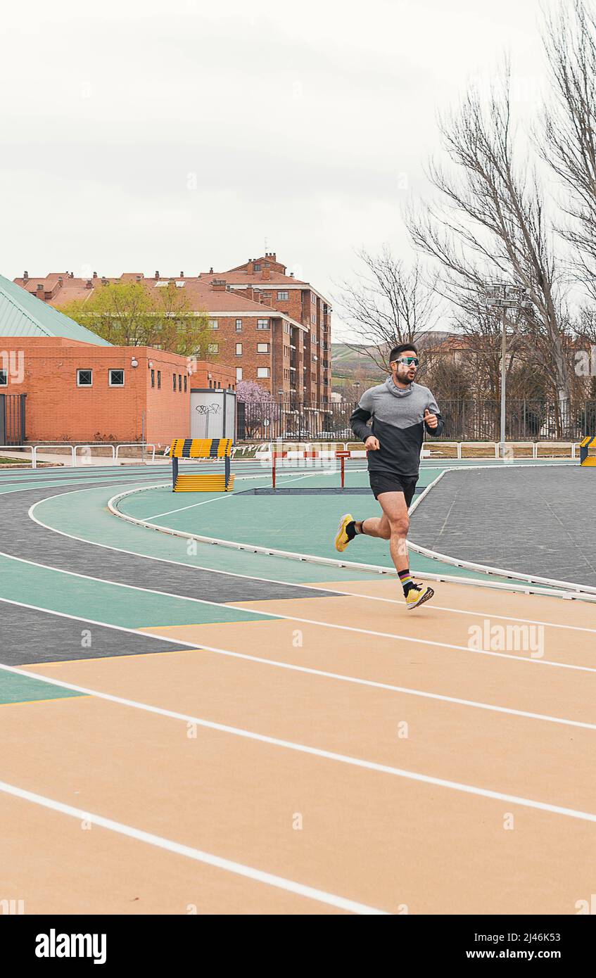 man running on a running track Stock Photo - Alamy