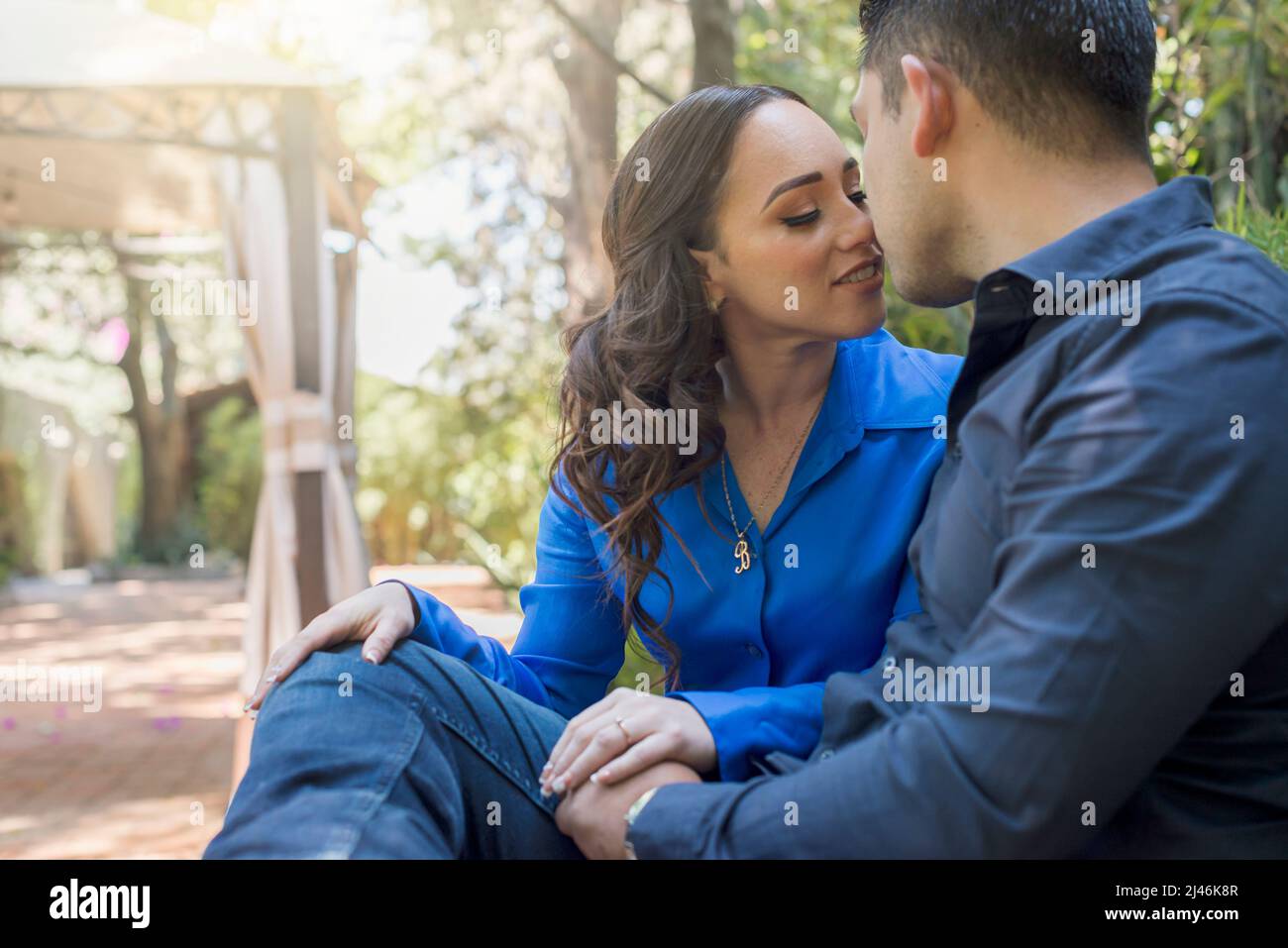 Romantic latin couple enjoying their love and ready to kiss each other ...