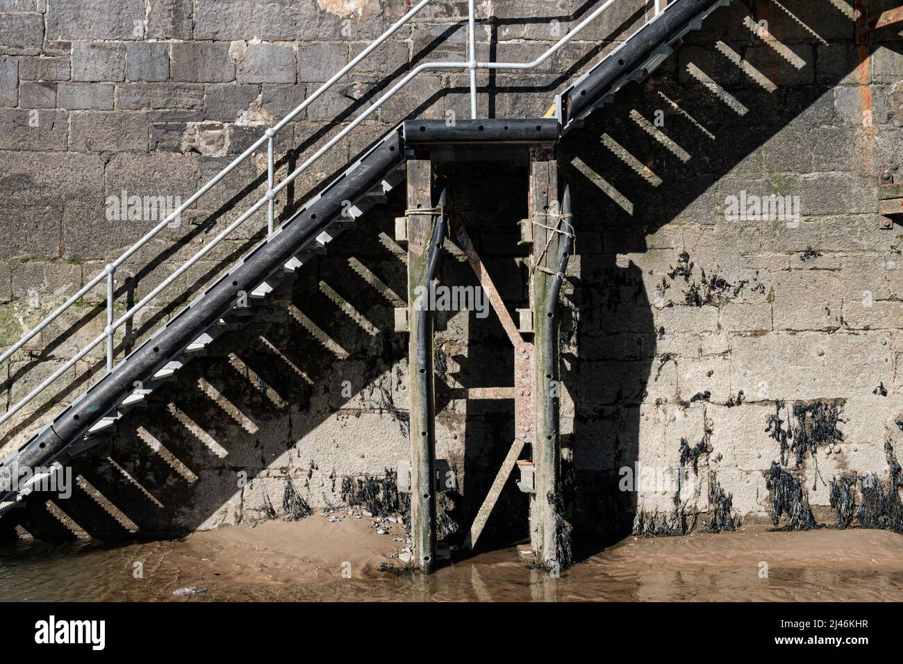 Steps on the Harbour Wall at Tenby, Pembrokeshire. At low tide Stock ...