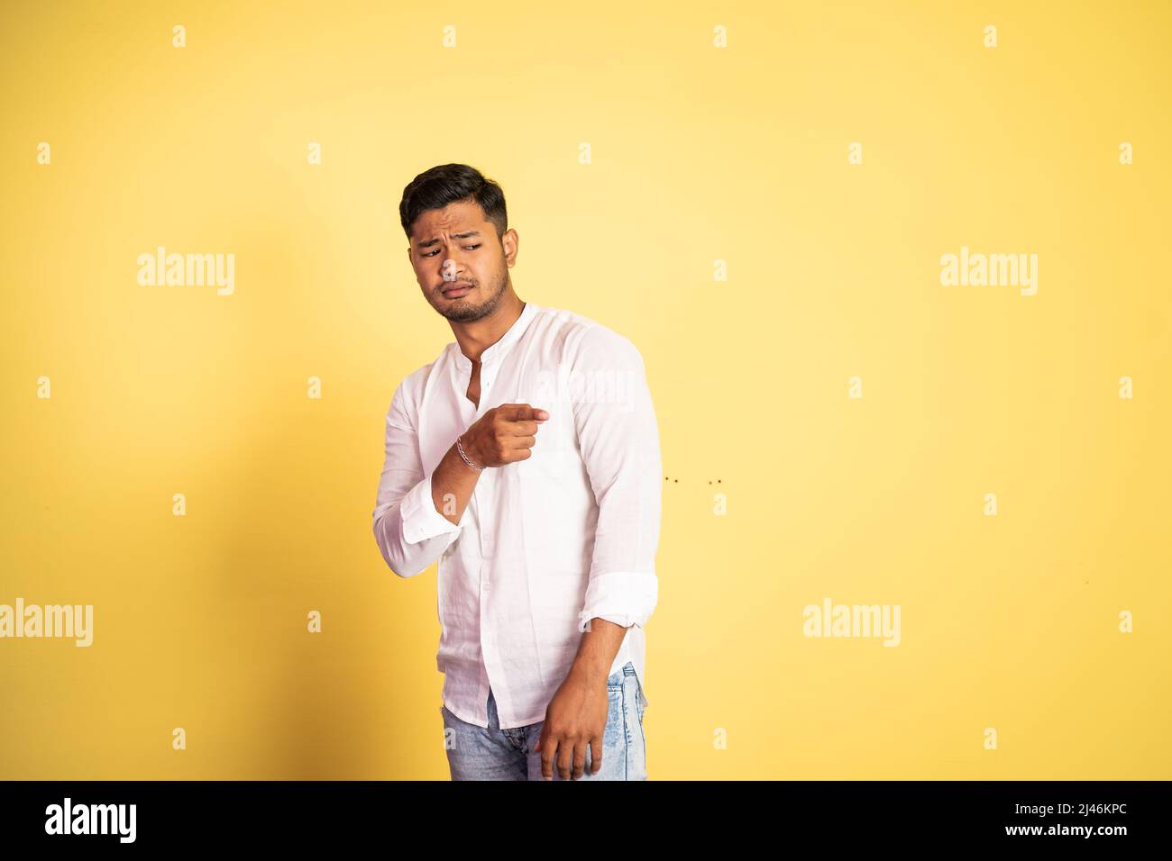 young asian man disdain expression pointing finger on isolated ...