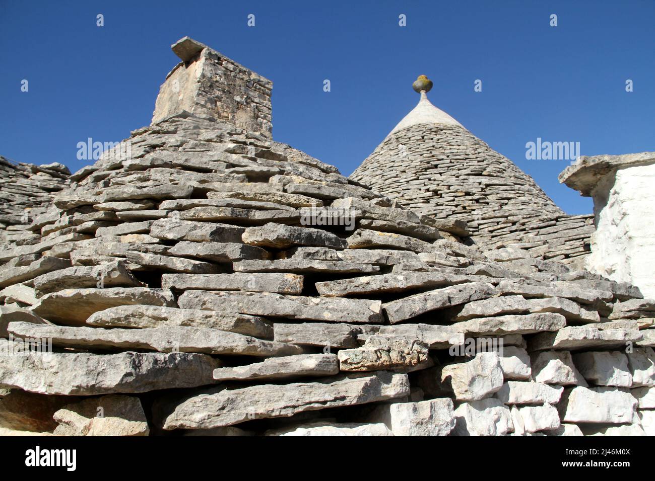 The conic roof, with pinnacle and chimney, of a 500-year-old ...
