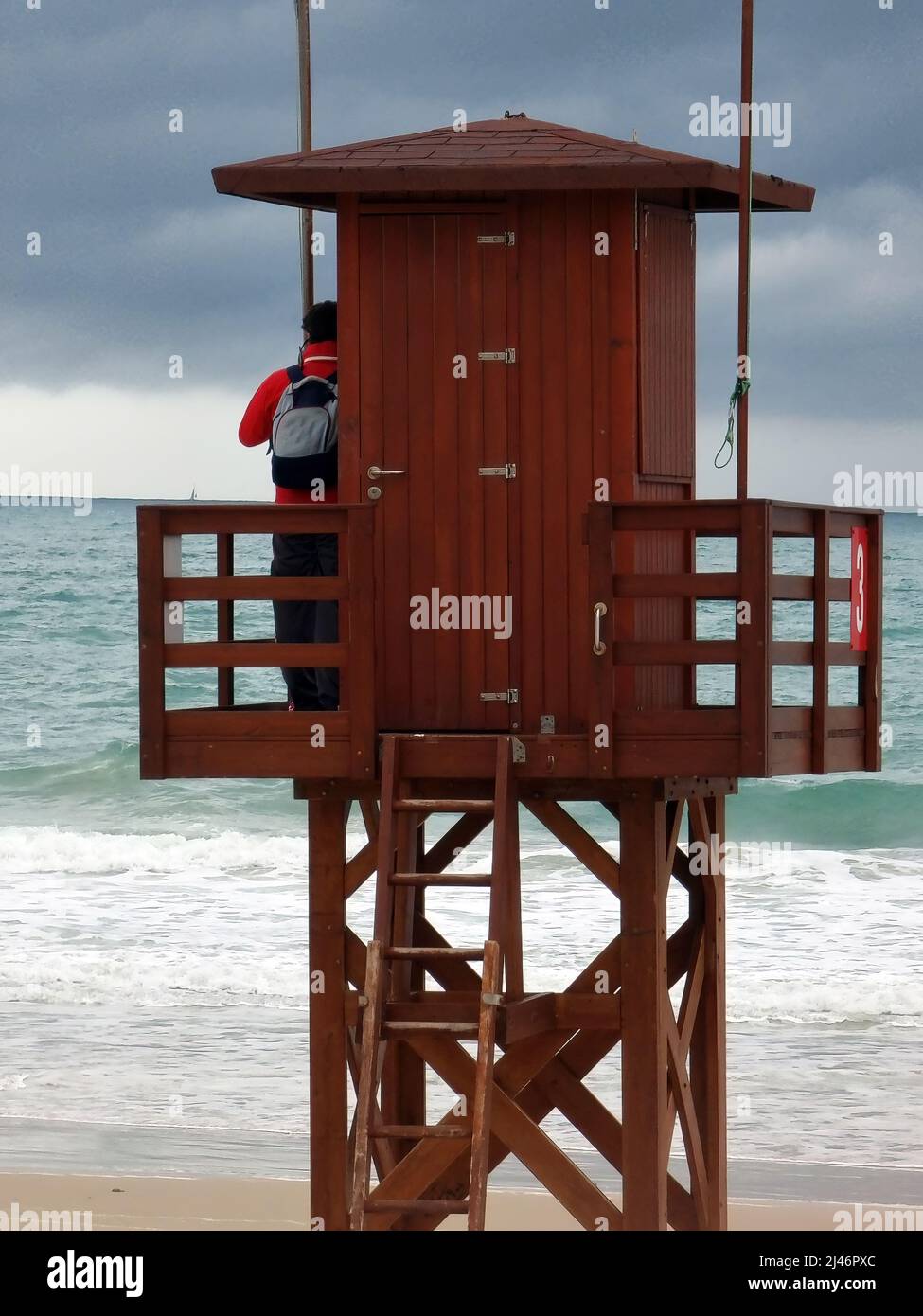 Beach watcher on the beach Stock Photo - Alamy