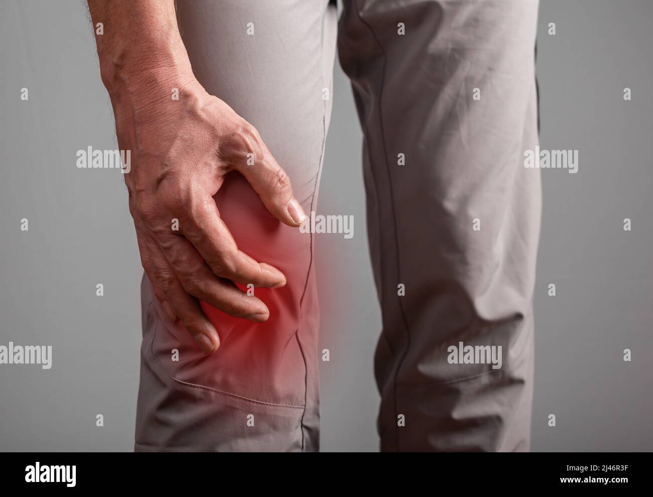 Knee pain. Man holding painful leg with red spot closeup. Arthritis ...